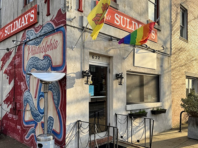 Sulimay's exterior welcomes you with old-school charm and a rainbow flag, promising both tradition and inclusivity in this Fishtown cornerstone.