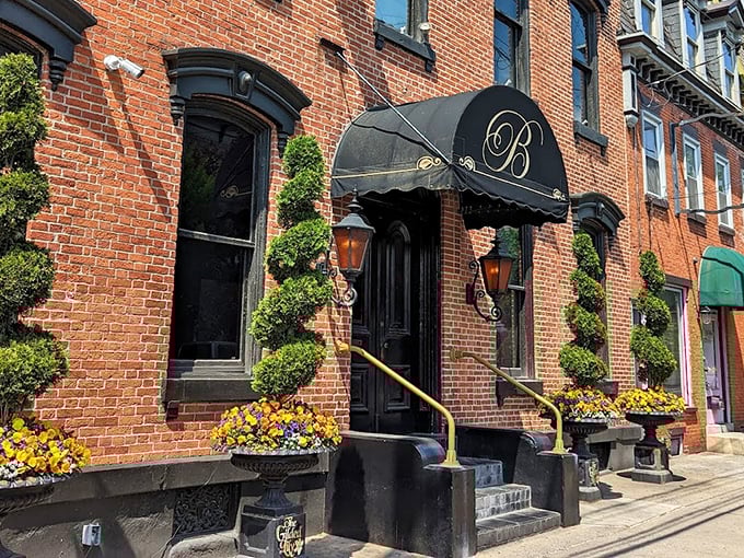 The elegant Victorian façade of The Belvedere Inn welcomes you with its signature black awning and seasonal flowers—Lancaster's version of a warm embrace.