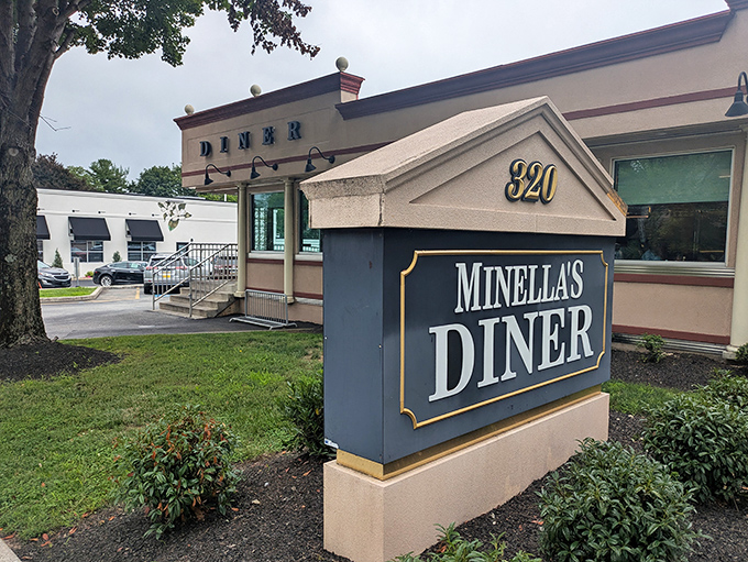 Minella's classic diner exterior stands like a beacon of breakfast hope on Lancaster Avenue, promising comfort food salvation to hungry Wayne residents.