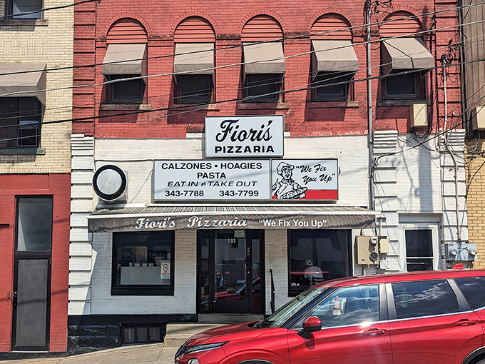 The brick facade of Fiori's Pizzaria stands like a culinary lighthouse on Brookline Boulevard, its iconic "We Fix You Up" promise beckoning hungry Pittsburghers for generations.