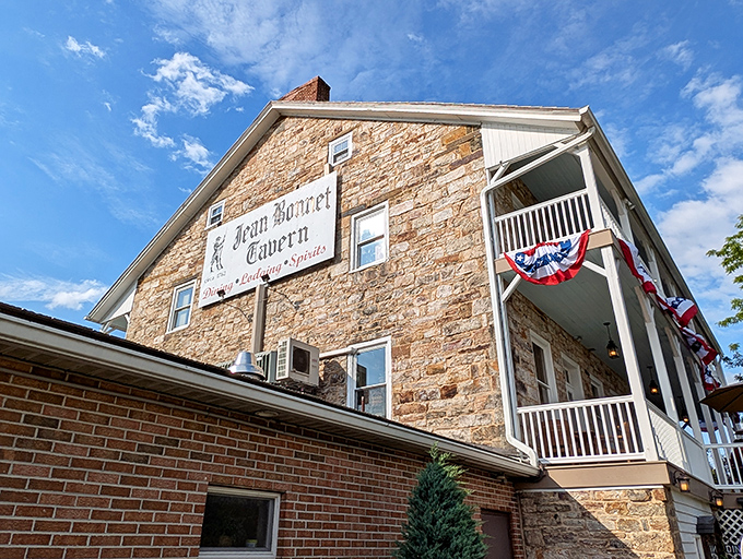 Stone walls that have witnessed centuries of American history stand proudly under blue Pennsylvania skies, welcoming hungry travelers to this historic culinary landmark.