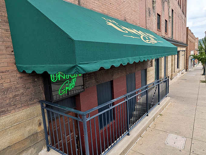 The iconic green awning and neon sign of Union Grill stand as a beacon for hungry travelers on Washington's Main Street. Small-town charm, big-time flavors await.