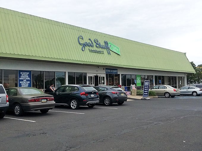 The green-roofed treasure chest beckons with its blue script sign, promising adventures in bargain hunting that'll make your wallet sing with joy.