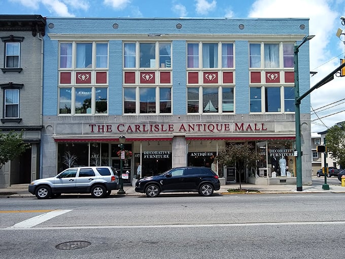 The iconic blue facade of The Carlisle Antique Mall stands proudly on Hanover Street, a siren call to treasure hunters and nostalgia seekers alike.