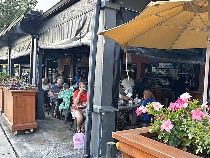 The iconic blue "Charleston STATE OF MIND" sign welcomes hungry patrons to Page's Okra Grill, where Southern hospitality begins before you even step inside.