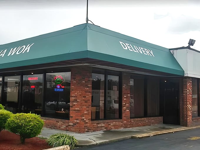 The iconic green awning of China Wok beckons hungry travelers like a culinary lighthouse on East Sullivan Street. No frills, just delicious promises. 