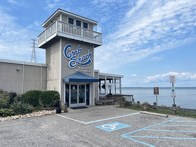 The watchtower-like structure isn't just for show—it's your lighthouse to seafood nirvana, perched right on the James River with views that rival the food.