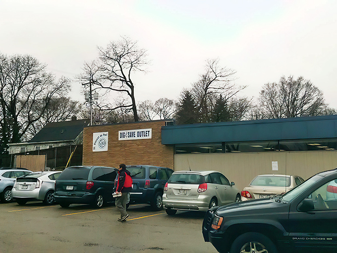 The unassuming blue facade of Dig & Save Outlet hides a treasure trove within—like finding a secret portal to bargain heaven in Madison.