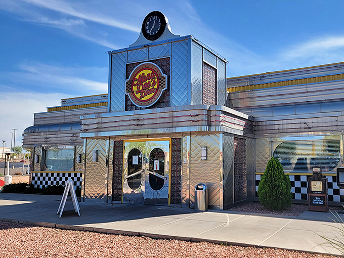 The gleaming chrome exterior of Nana Dee's stands like a time portal to the 1950s, complete with that iconic clock announcing it's always mealtime inside.