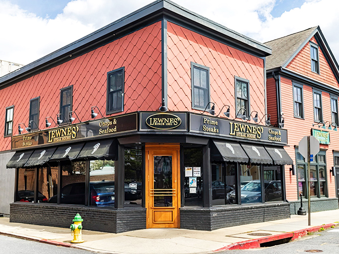 The iconic coral-colored exterior of Lewnes' Steakhouse stands as a beacon for steak lovers in Annapolis, promising old-school charm and timeless flavors inside.