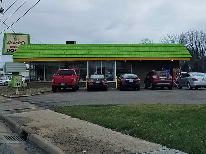 That iconic lime green roof isn't just a landmark—it's a beacon of hope for anyone who believes breakfast should involve sugar and joy.