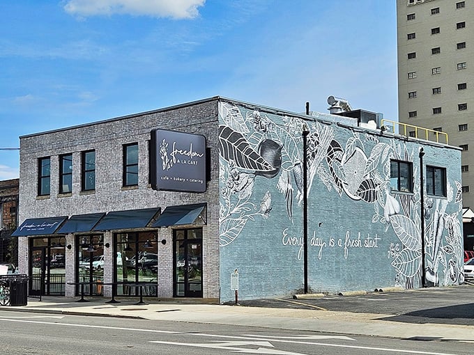 The blue-gray building with its elegant botanical mural isn't just eye-catching—it's practically whispering "come inside and eat something wonderful."