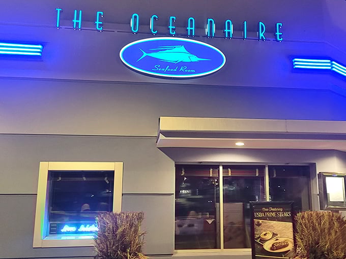 The blue glow of The Oceanaire's iconic sign promises maritime delights within—like a lighthouse guiding hungry sailors to culinary treasure.