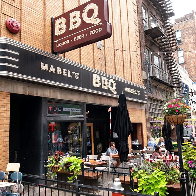 The brick façade of Mabel's BBQ beckons from East 4th Street like a smoky siren song. Cleveland's barbecue haven awaits behind those doors.