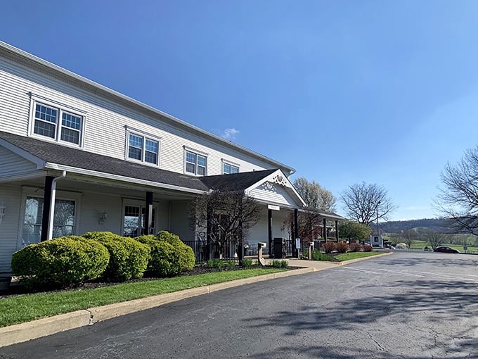 The stately white exterior of Amish Door Restaurant stands like a culinary lighthouse, beckoning hungry travelers across Ohio's rolling countryside.
