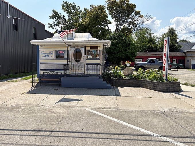 The iconic Park Dinor sign stands tall against the Erie sky, beckoning hungry travelers with its vintage charm and promise of classic American comfort food.