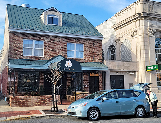 The distinctive green roof and brick façade of Peach Blossom Eatery stands like a breakfast lighthouse on Newark's Main Street, beckoning hungry souls to culinary salvation. 