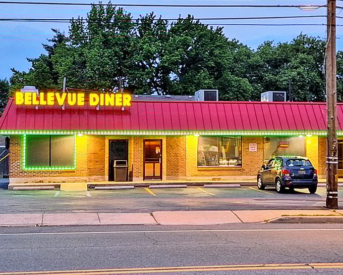 The neon-trimmed Bellevue Diner glows like a beacon of breakfast hope along Wilmington's streetscape. That red roof promises comfort food salvation for hungry Delaware souls.
