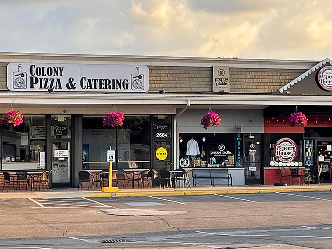 Colony Pizza's unassuming storefront hides culinary treasures within. Those hanging flower baskets aren't just for show—they're a welcome sign that good things await inside.