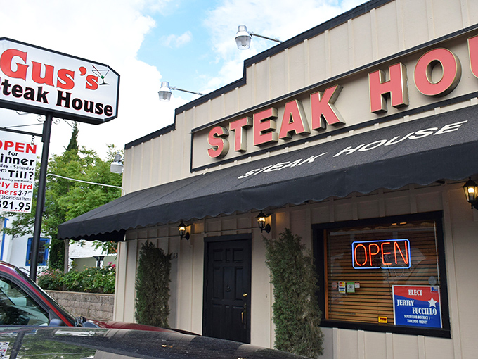 The classic red lettering against cream siding isn't just signage—it's a beacon of hope for hungry travelers. Gus's Steakhouse promises what we all secretly crave: simplicity done spectacularly.