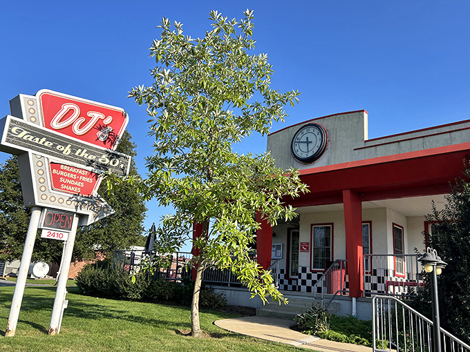 The classic neon sign beckons like a time portal to simpler days. DJ's red and white exterior promises nostalgic delights within.