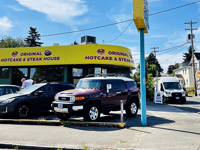 The neon beacon of breakfast salvation stands proudly on SE Powell, promising 24-hour comfort food when Portland needs it most.