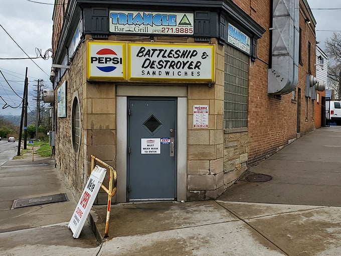 The unassuming brick exterior of Triangle Bar & Grill stands like a sandwich fortress in Swissvale, proudly announcing its naval-themed sandwich arsenal to Pittsburgh's hungry masses.