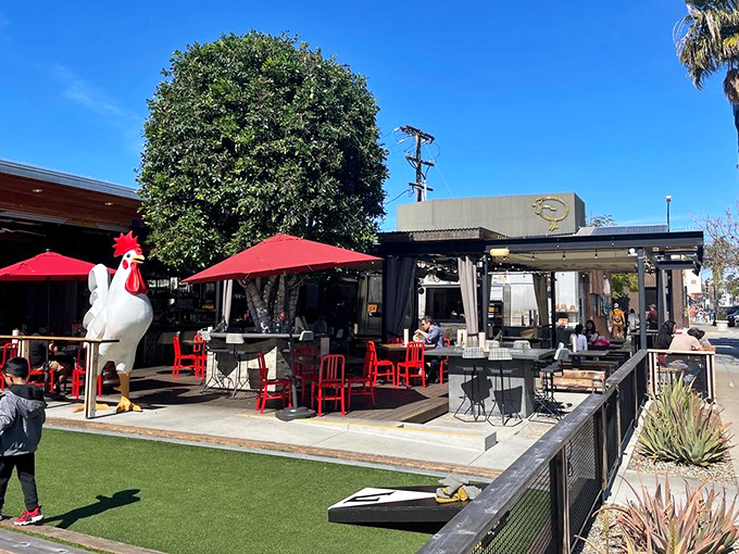 The giant chicken statue standing guard outside The Crack Shack isn't just decoration—it's a beacon calling to hungry souls across San Diego's Little Italy neighborhood.