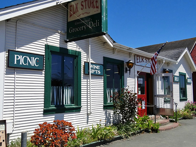 Classic Americana at its finest—the Elk Store's white clapboard exterior with burgundy trim promises culinary treasures behind those unassuming doors.