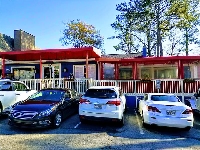 The little blue house with the bright red porch that's causing traffic jams in Buckhead isn't selling real estate—it's serving breakfast worth setting your alarm for.