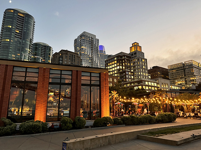 Waterbar at twilight—where San Francisco's skyline serves as the ultimate dinner date backdrop. Those string lights aren't just decoration; they're urban fireflies guiding you to seafood nirvana.