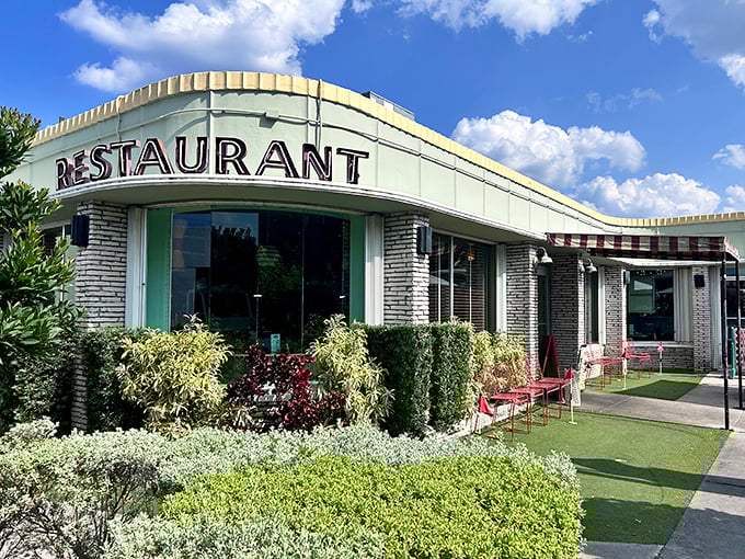 The mint-green time machine of Howley's beckons with its classic "RESTAURANT" sign—a mid-century promise of comfort that never goes out of style.