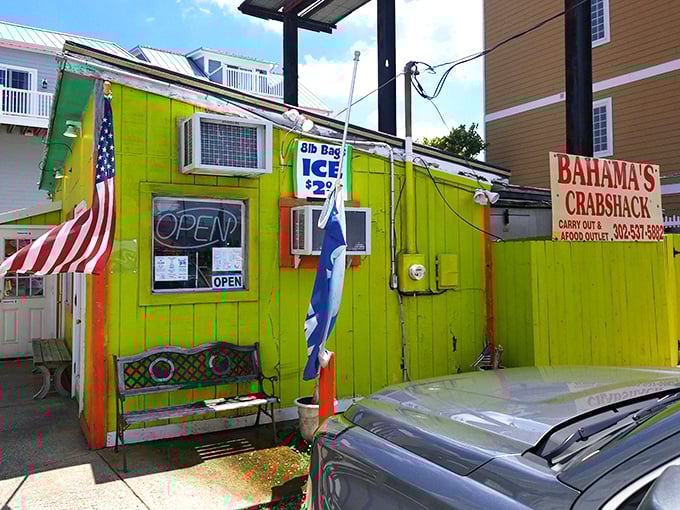 The lime-green beacon of seafood salvation! Bahama's Crabshack stands out like a neon treasure chest on Fenwick Island, promising oceanic delights within.
