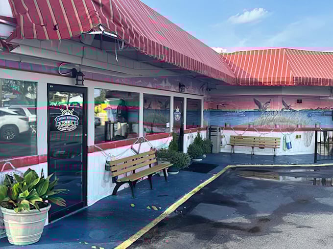 With its bold red awning, seaside mural, and casual benches out front, this unassuming spot looks like a beachside shack—but inside, it’s a seafood sanctuary locals can’t stop raving about.