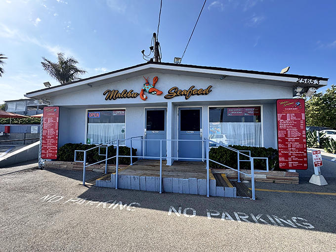 The unassuming white building with its cheerful lobster sign promises seafood nirvana. No fancy frills needed when the ocean is your backdrop.