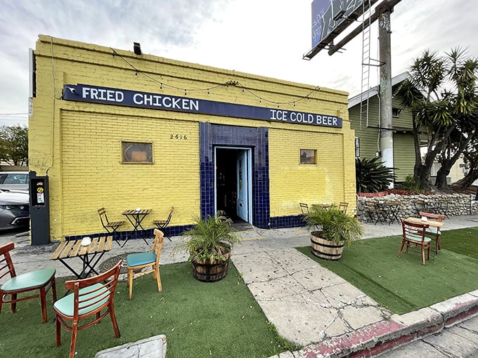 The yellow brick building with its straightforward "FRIED CHICKEN" and "ICE COLD BEER" sign is like a culinary lighthouse guiding hungry souls to salvation.
