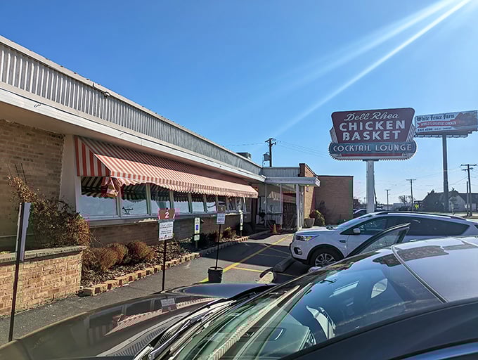 The iconic red and white awnings of Dell Rhea's welcome hungry travelers like a beacon of fried chicken salvation along Route 66.