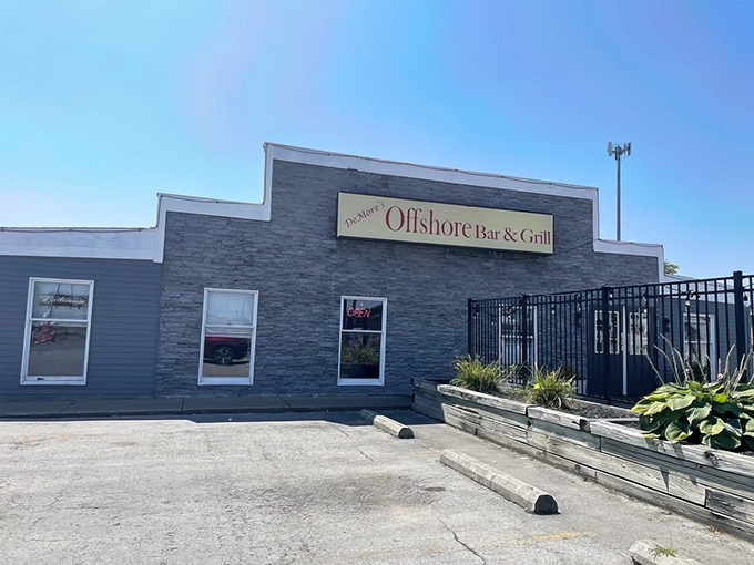 The unassuming stone facade of DeMore's Offshore Bar & Grill stands like a culinary lighthouse on Sandusky's shores, promising seafood treasures within.