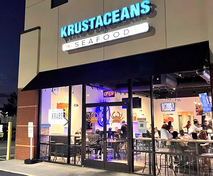 The blue glow of Krustaceans' sign beckons seafood lovers like a lighthouse calling ships to shore. Nashville's answer to coastal cravings.