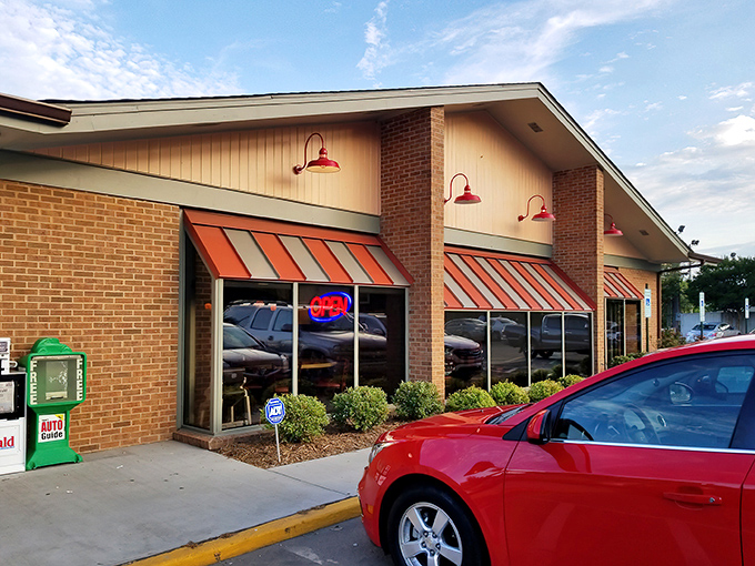 The unassuming brick exterior with orange-striped awnings promises no frills, just honest-to-goodness food that keeps locals coming back day after day.