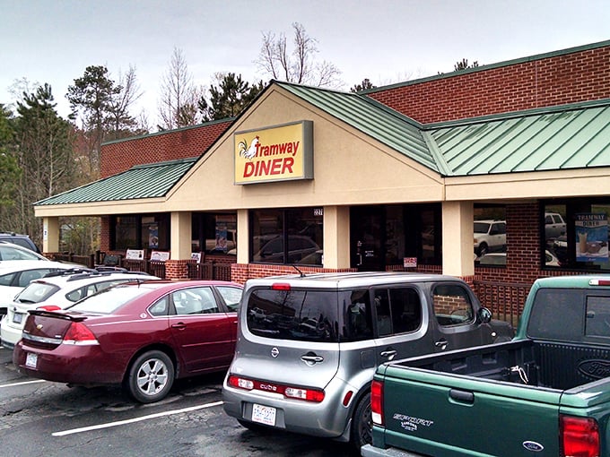 The unassuming exterior of Tramway Diner hides breakfast treasures within. That packed parking lot? Not a coincidence, folks.