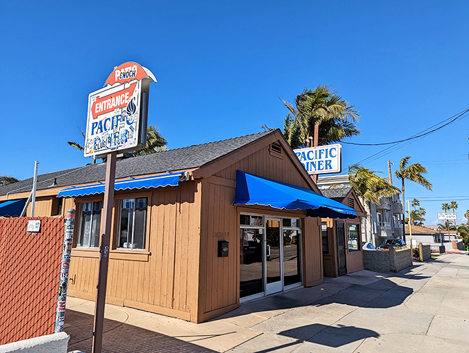 The unassuming exterior of Pacific Diner stands like a culinary lighthouse in San Pedro, its bright blue awning a beacon for breakfast seekers.
