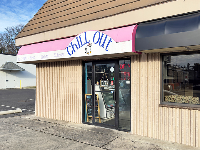 The unassuming exterior of Chill Out Ice Cream shares space with a pizza place, proving that life's greatest pleasures often hide in plain sight.