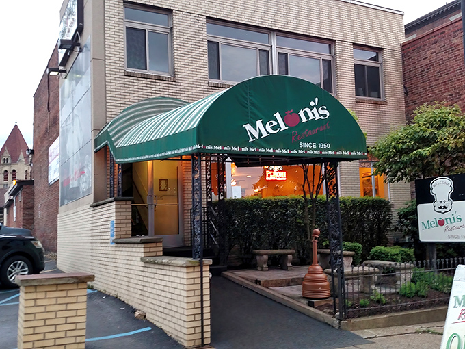 The unassuming brick exterior of Meloni's might not stop traffic, but locals know this modest façade hides culinary treasures that have satisfied Uniontown appetites for generations.