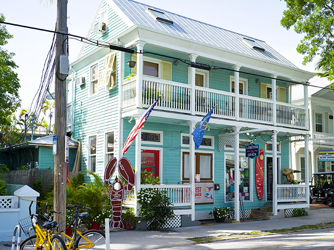 The turquoise charm of The Lobster Shack beckons seafood pilgrims from across Florida. That giant lobster out front isn't just decoration—it's a promise.