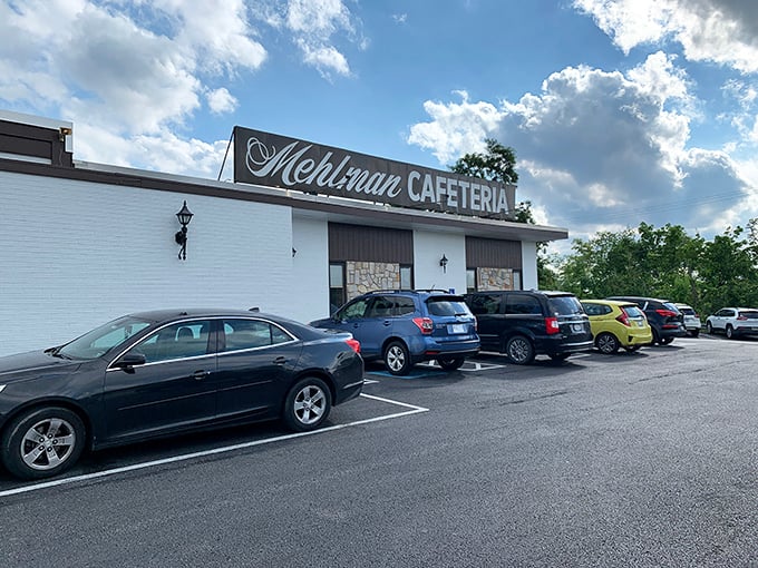 The unassuming white exterior of Mehlman's Cafeteria stands like a culinary time capsule, promising comfort food treasures that no trendy bistro could match.