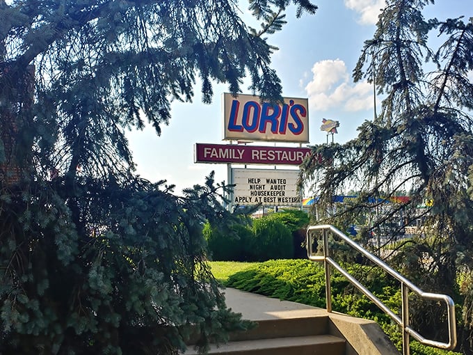 The classic roadside sign for Lori's Family Restaurant stands tall against Ohio's blue skies, promising homestyle comfort that's worth pulling over for.