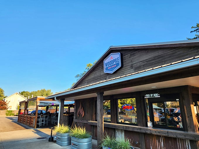 The rustic wooden exterior of Woodpile BBQ Shack promises what every barbecue lover knows: the less fancy it looks, the better the meat tastes.