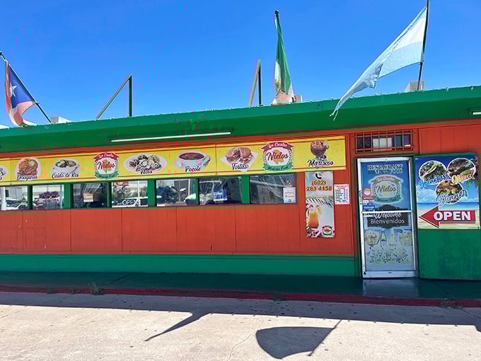 The vibrant exterior of Los Cuatro Nietos announces itself with colorful murals and flags, like a culinary carnival beckoning hungry passersby.