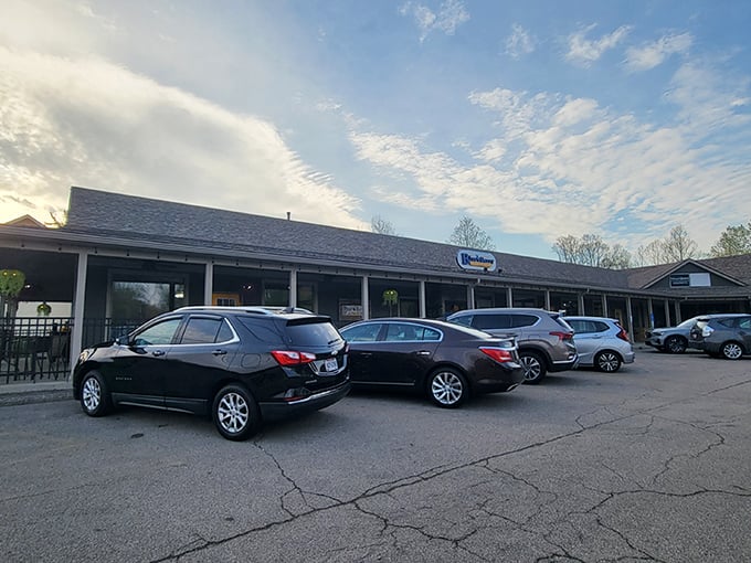 The unassuming exterior of The Blue Berry Café belies the culinary treasures within. Like all great breakfast spots, the packed parking lot tells the real story.